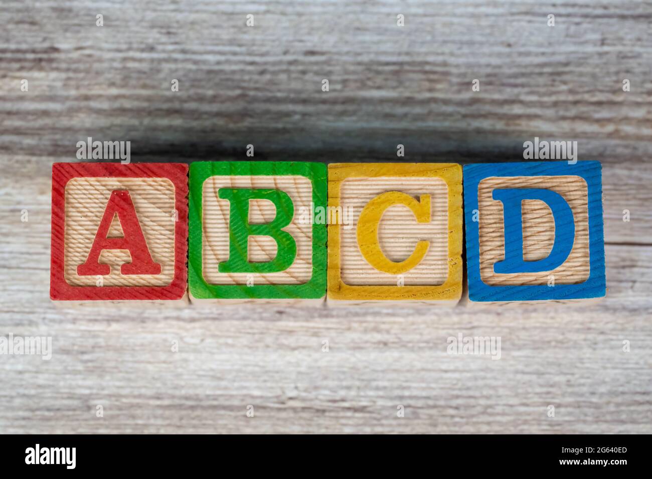 ABCD letter education wood block on table Stock Photo - Alamy