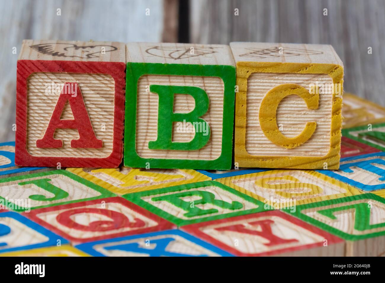 ABC education wood block stack together Stock Photo - Alamy