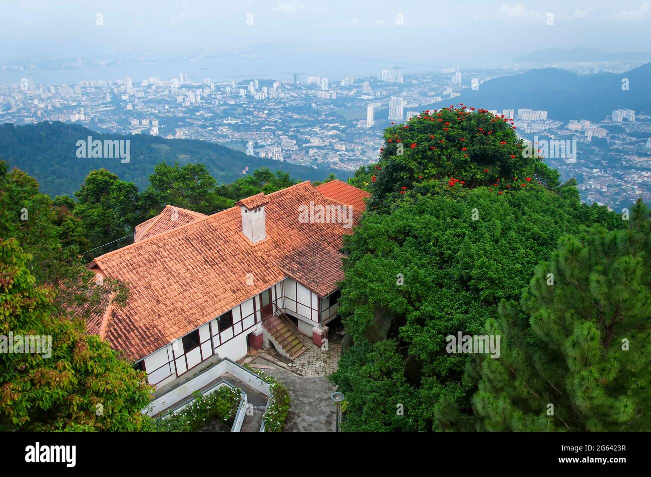 a building on top of penang hill with the city of air itam, penang ...