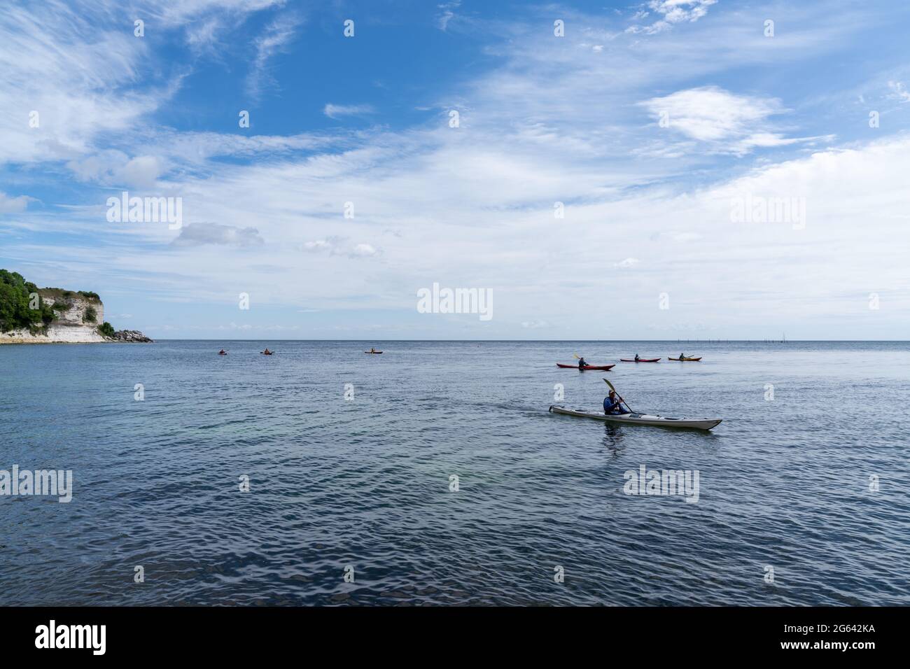 Hojerup, Denmark - 12 June, 2021: group of sea kayakers paddling off ...