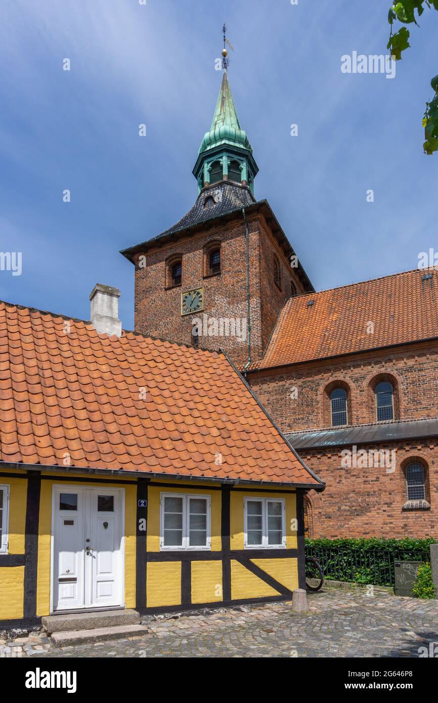 Svendborg, Denmark - 10 June, 2021: red brick church and yellow half ...