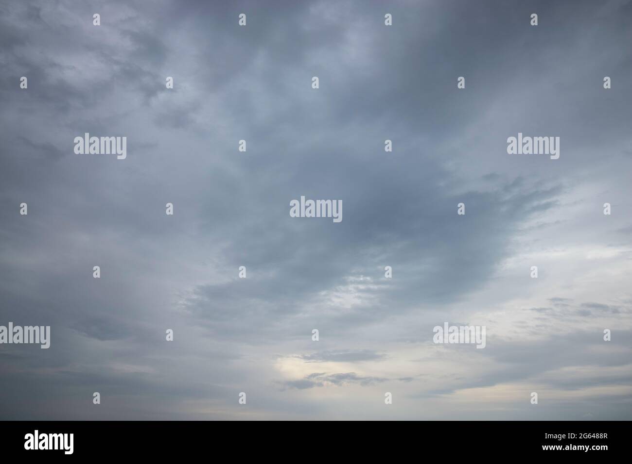 summer cloudy gray sky and rare sun gleams Stock Photo - Alamy