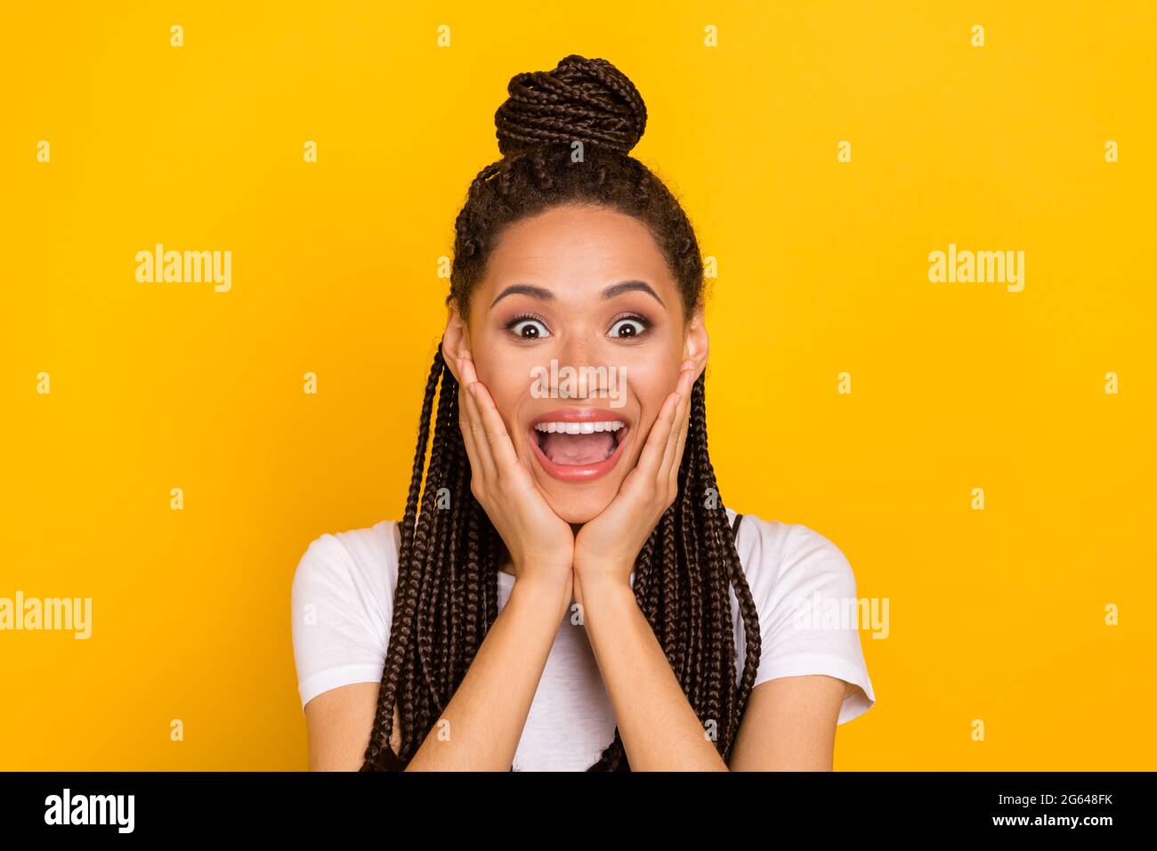 Photo Of Impressed Funny Dark Skin Lady Wear Casual Clothes Arms Cheeks
