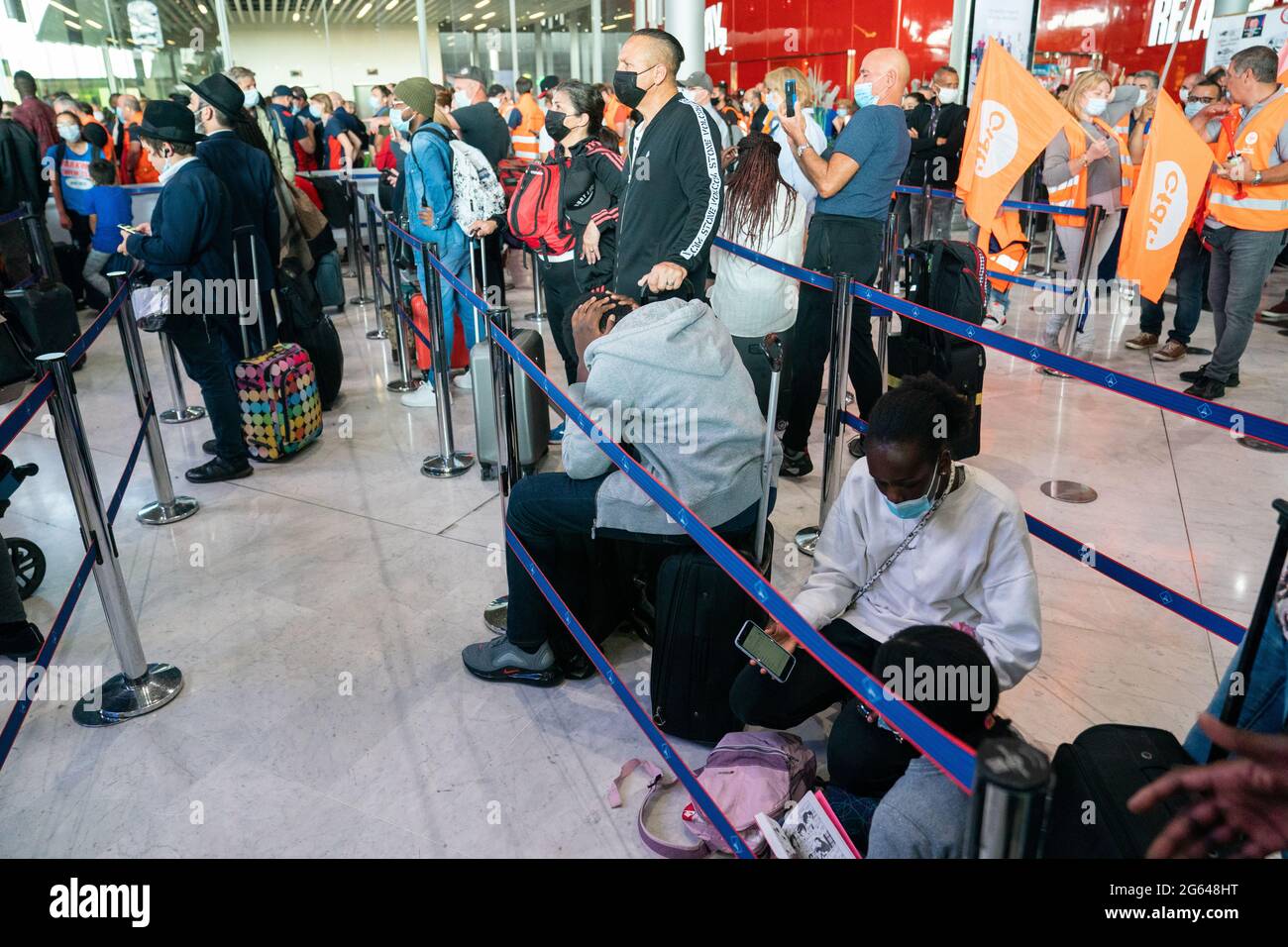 Charles De Gaulle Paris airport workers block terminal to protest for ...
