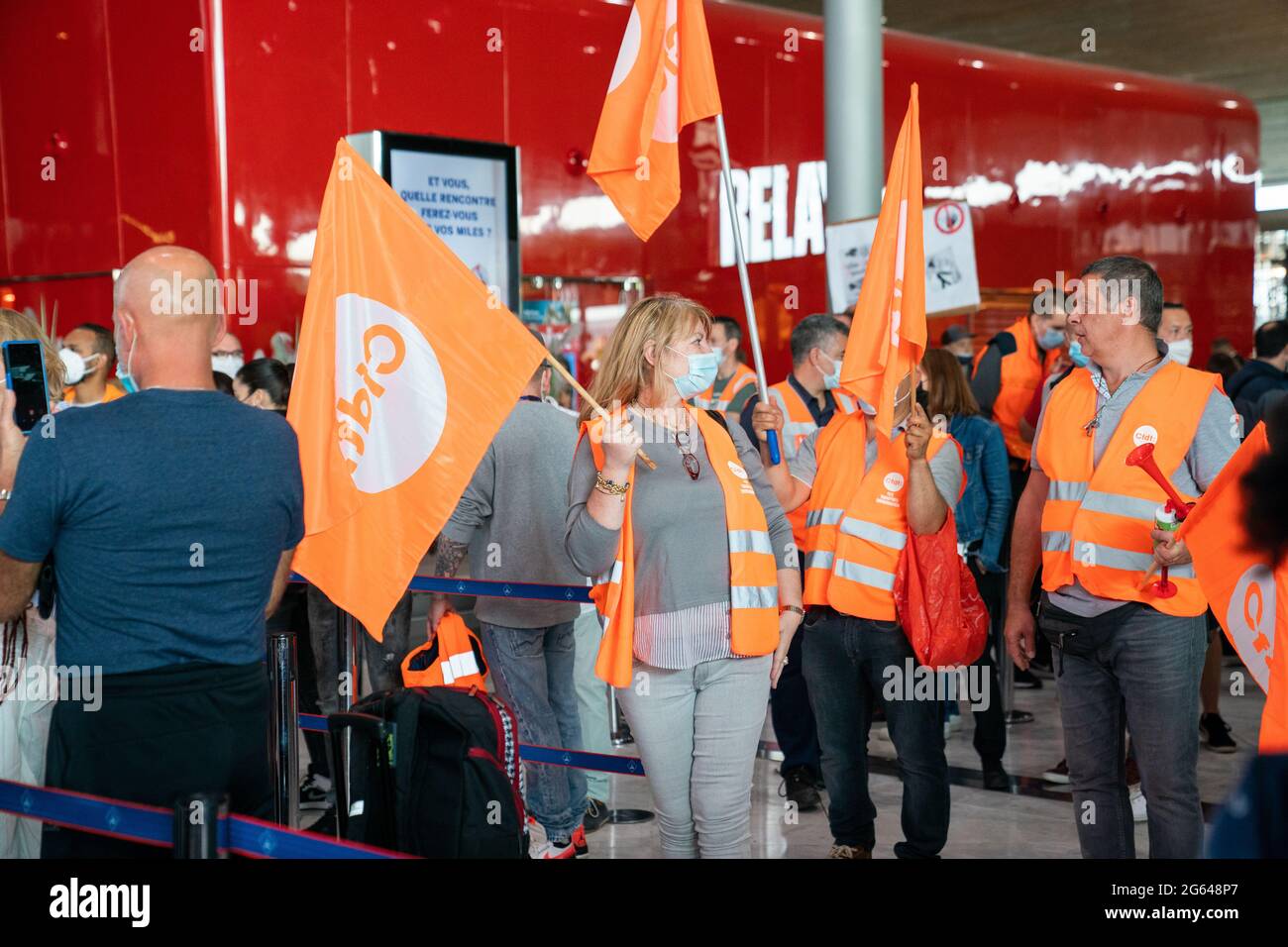 Charles De Gaulle Paris airport workers block terminal to protest for ...