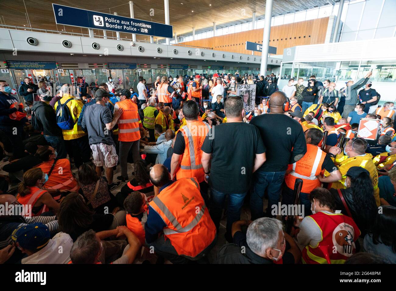 Charles De Gaulle Paris airport workers block terminal to protest for ...