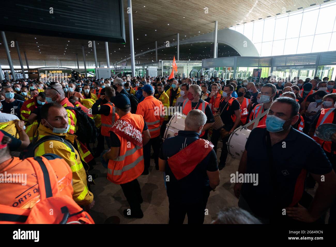 Charles De Gaulle Paris airport workers block terminal to protest for ...