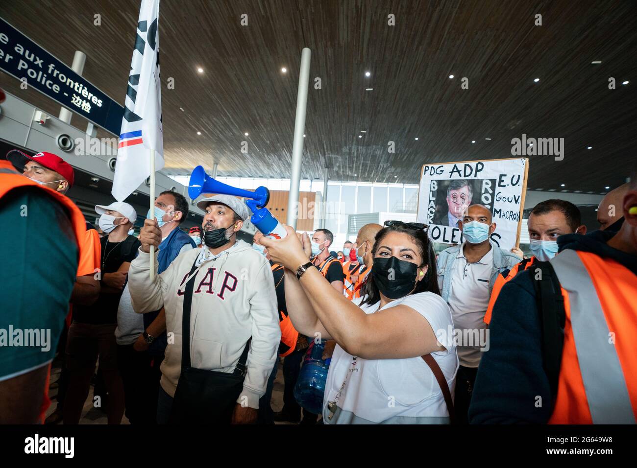 Charles De Gaulle Paris airport workers block terminal to protest for ...