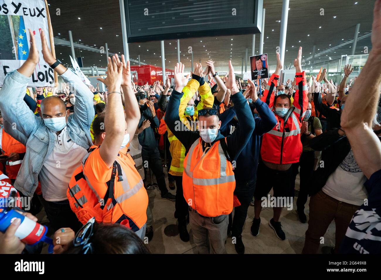 Charles De Gaulle Paris airport workers block terminal to protest for ...
