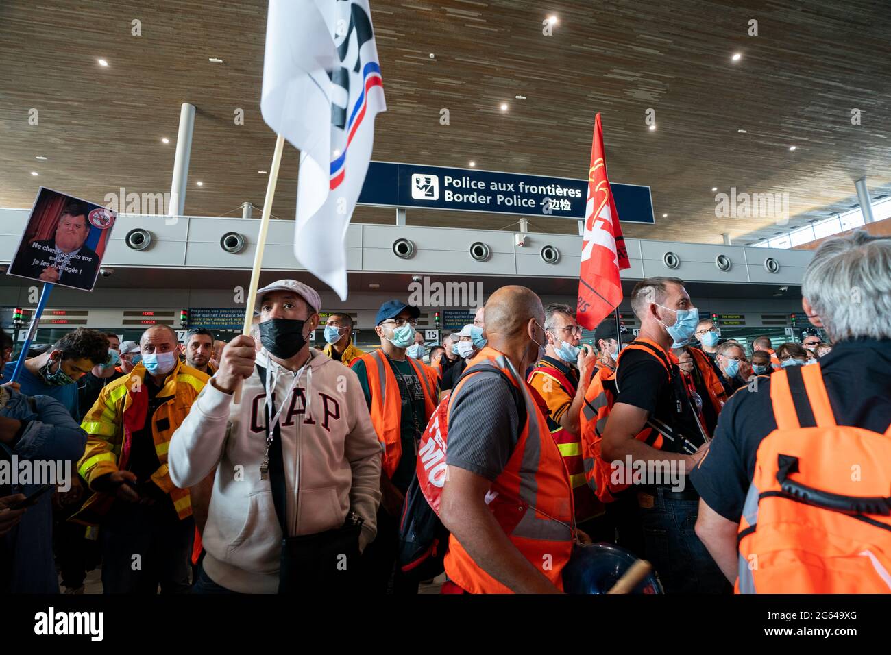 Charles De Gaulle Paris airport workers block terminal to protest for ...