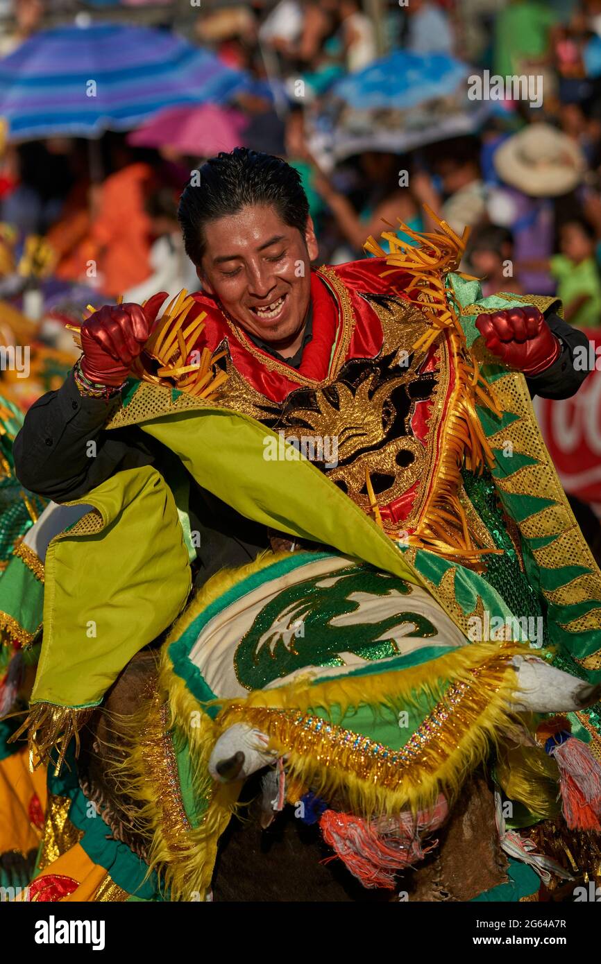 Members of a Waca Waca dance group in ornate costume performing at the ...