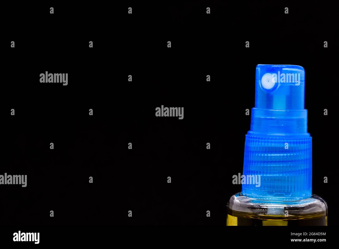 Close up shot of blue spray nozzle dispenser in black background. with ...