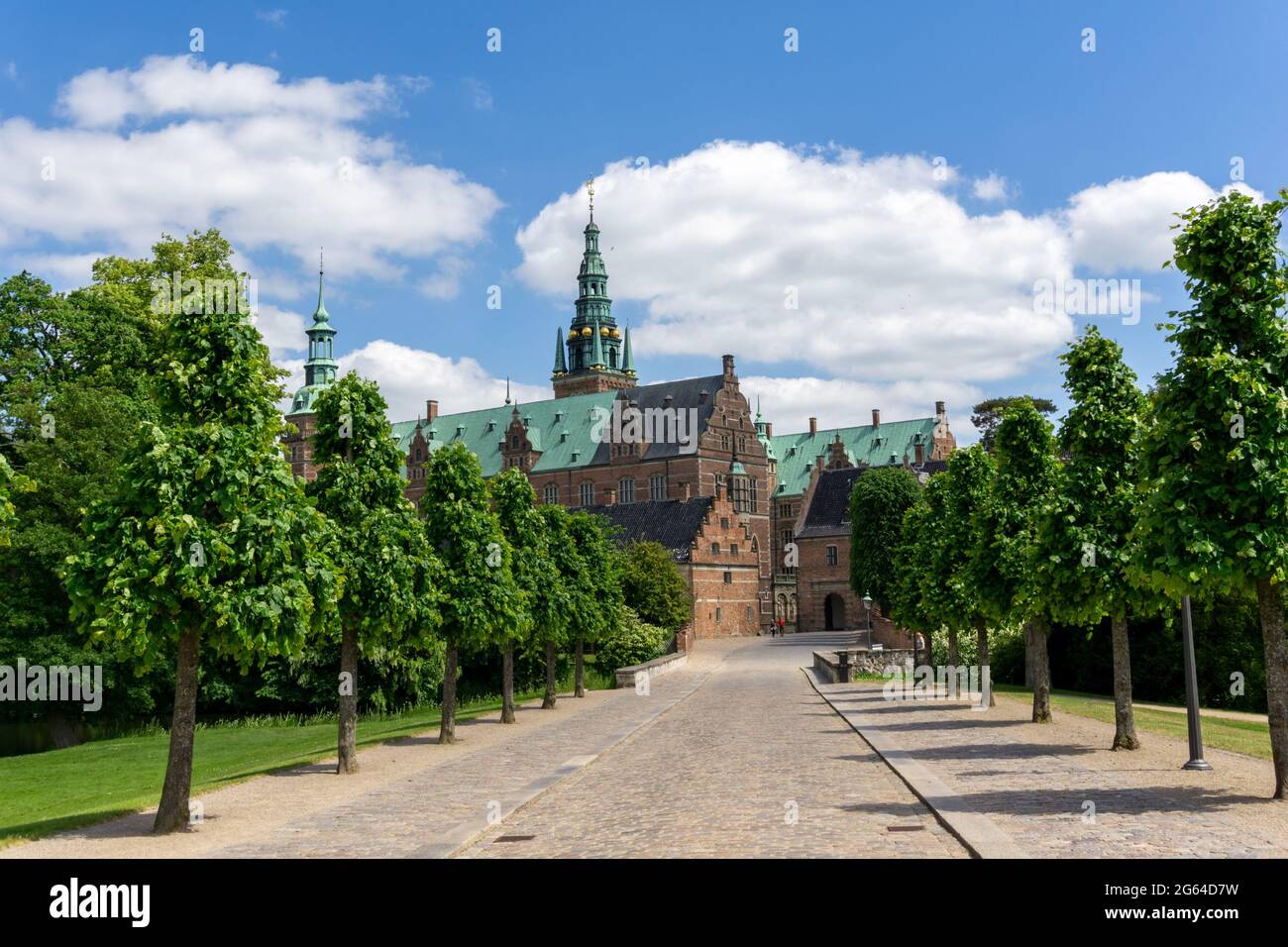 Hillerod, Denmark - 16 June, 2021: long tree-lined alley leading to the ...