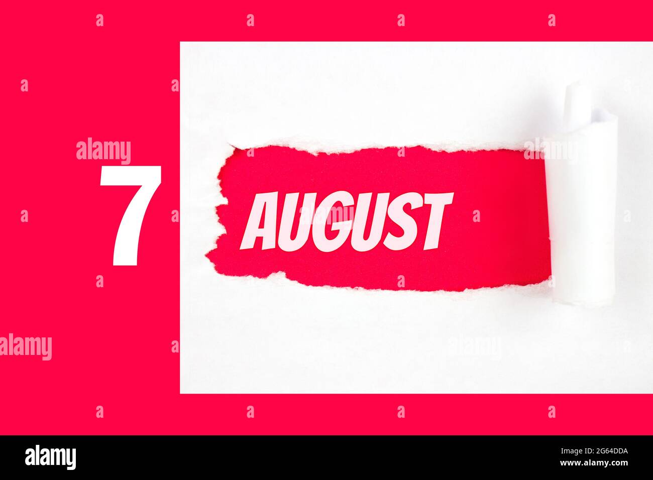 August 7th. Day 7 of month, Calendar date. Red Hole in the white paper ...