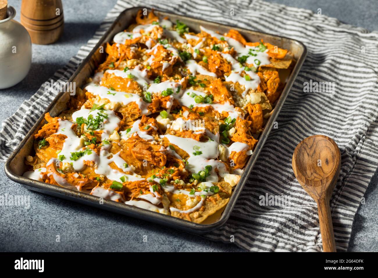 Homemade Buffalo Chicken Nachos with Ranch and Onions Stock Photo - Alamy