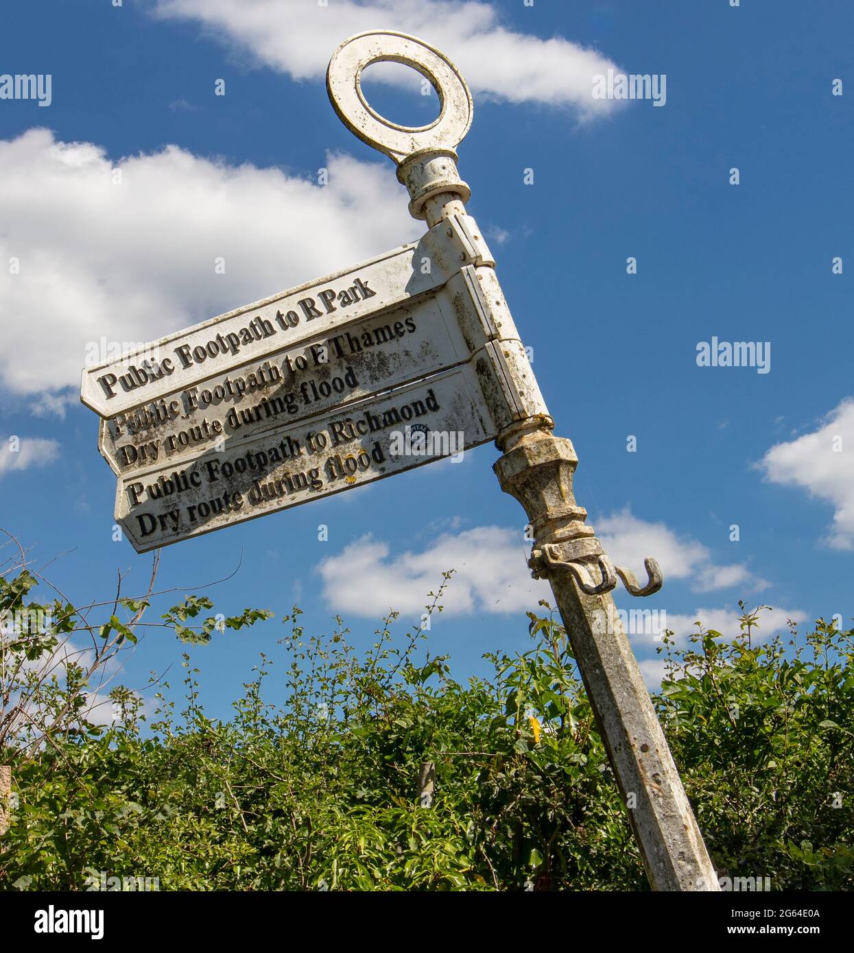 Sign on pathway in Richmond Park, London, leaning at drunken angle ...