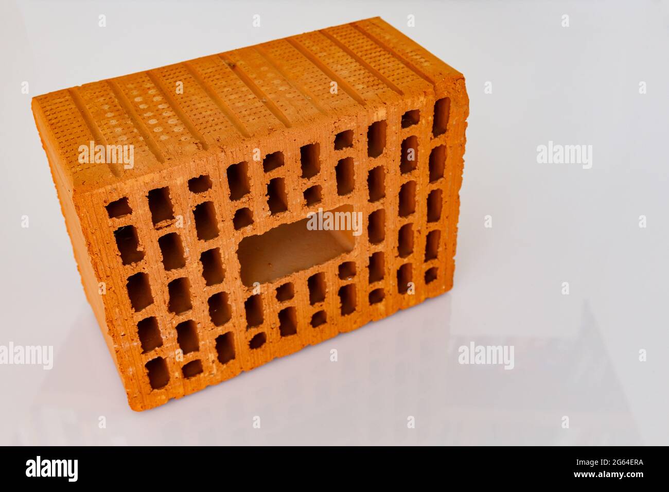 A red brick on white background Stock Photo - Alamy