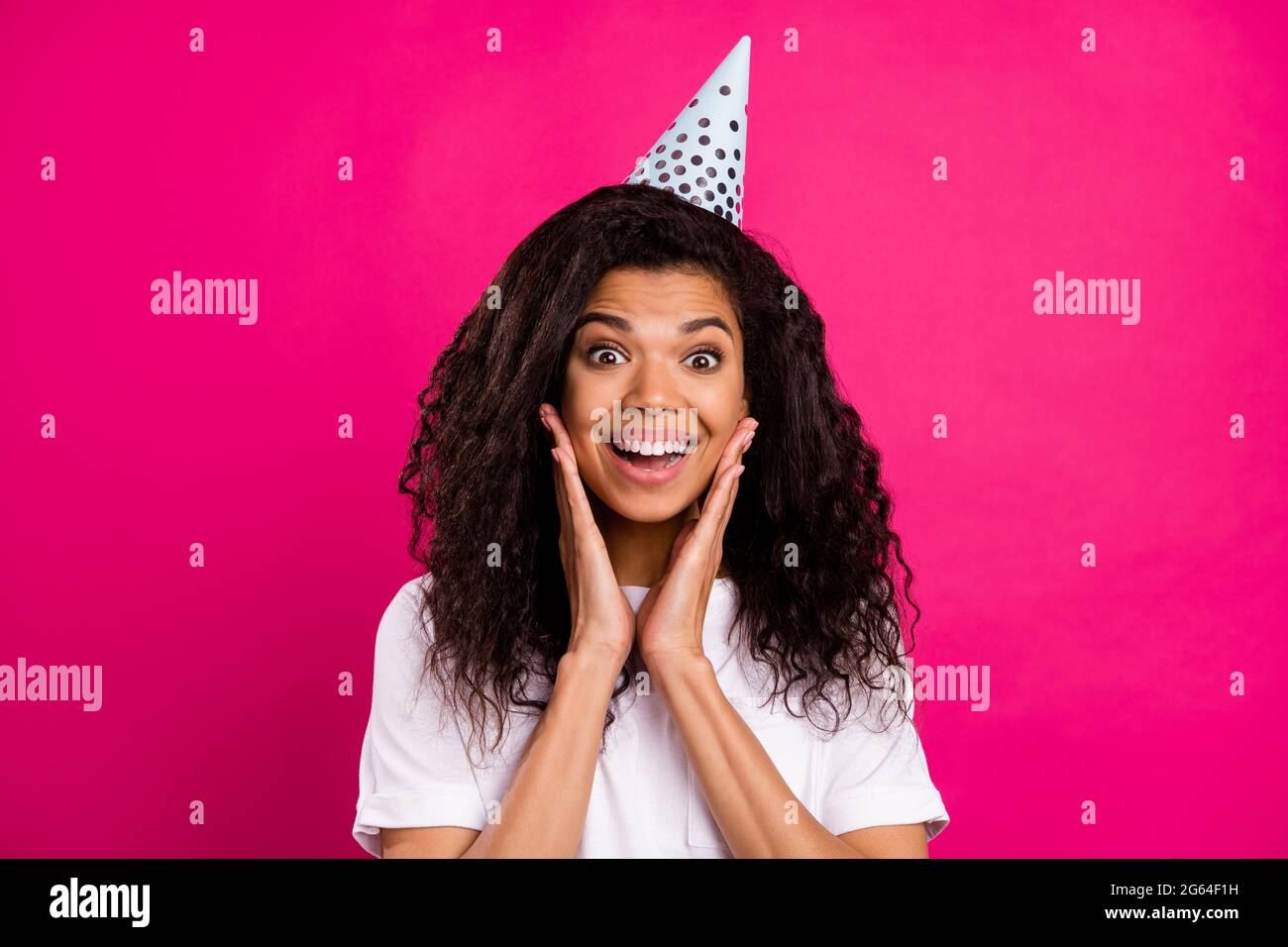 Photo of hooray brunette young party lady hands face wear cap white t ...