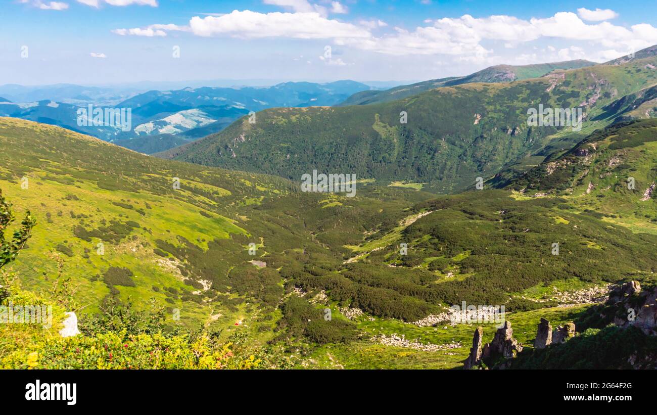 Amazing mountain landscape with blue sky with white clouds, sunny ...