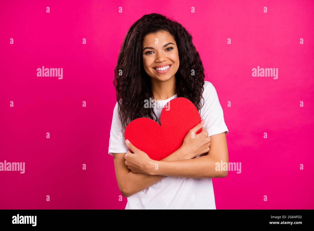 Photo Of Nice Brunette Millennial Lady Hug Heart Wear White T Shirt