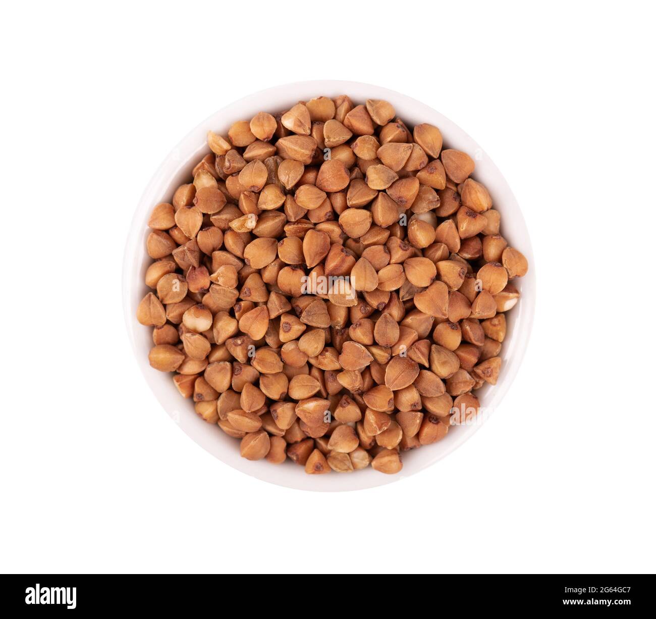 Roasted buckwheat grains in bowl, isolated on white background. Dry ...