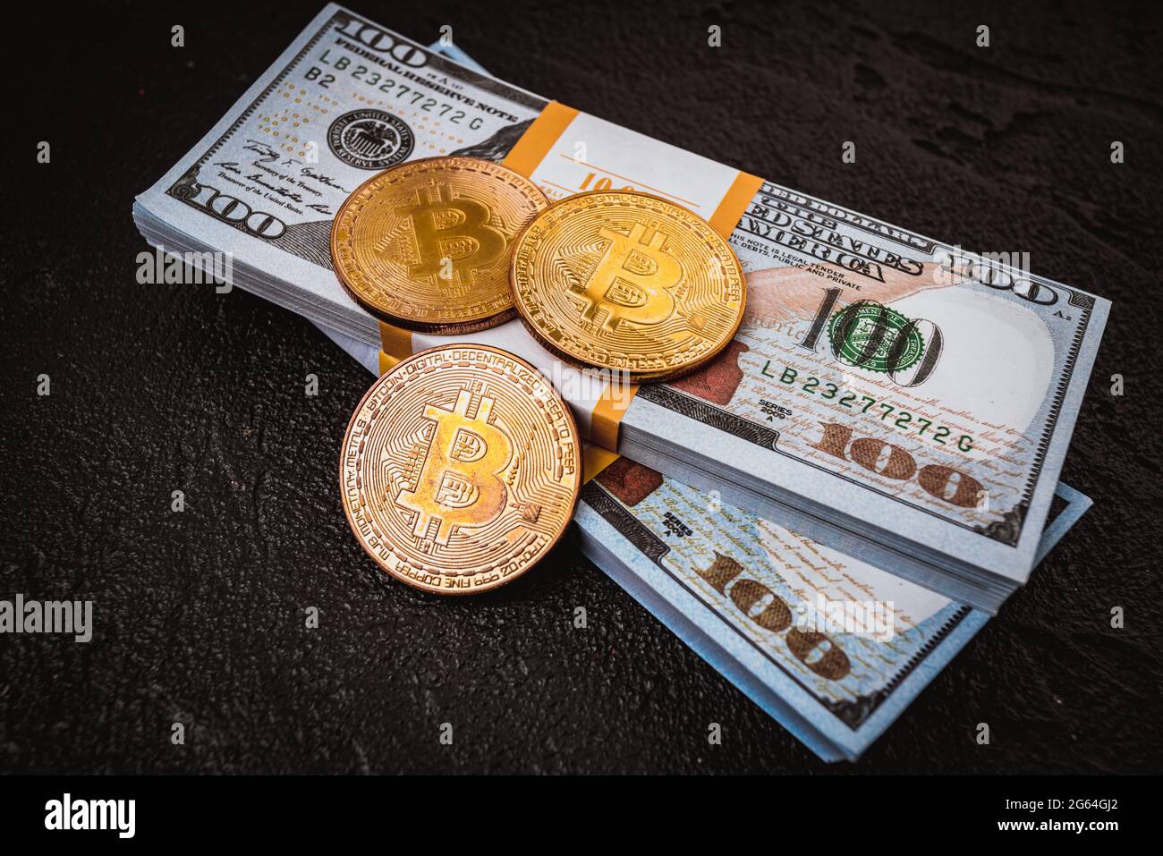 golden bitcoin metal coin on one US dollar bill Stock Photo - Alamy