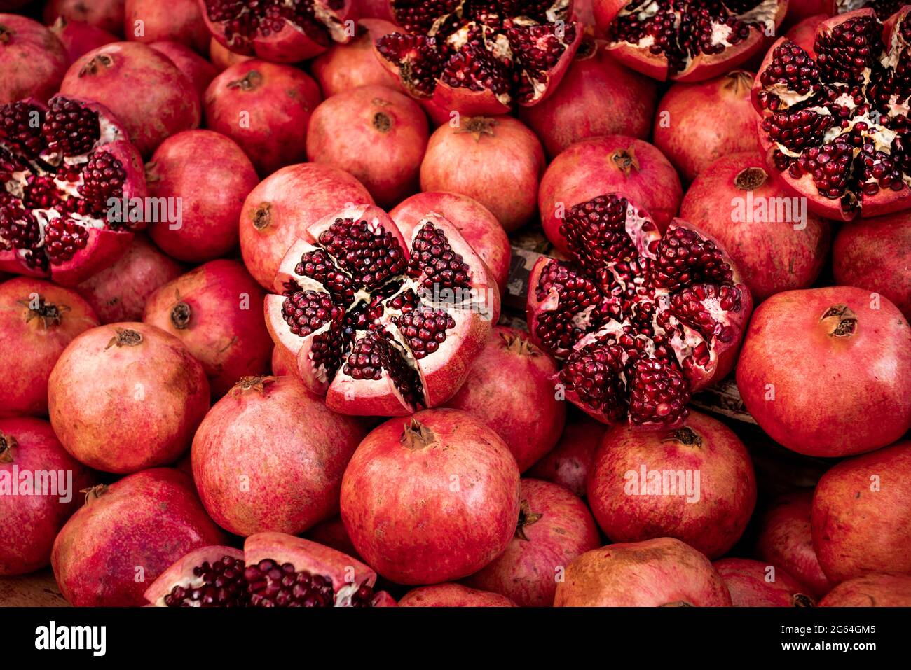 Cracked pomegranate. Ripe pomegranate close-up Stock Photo - Alamy