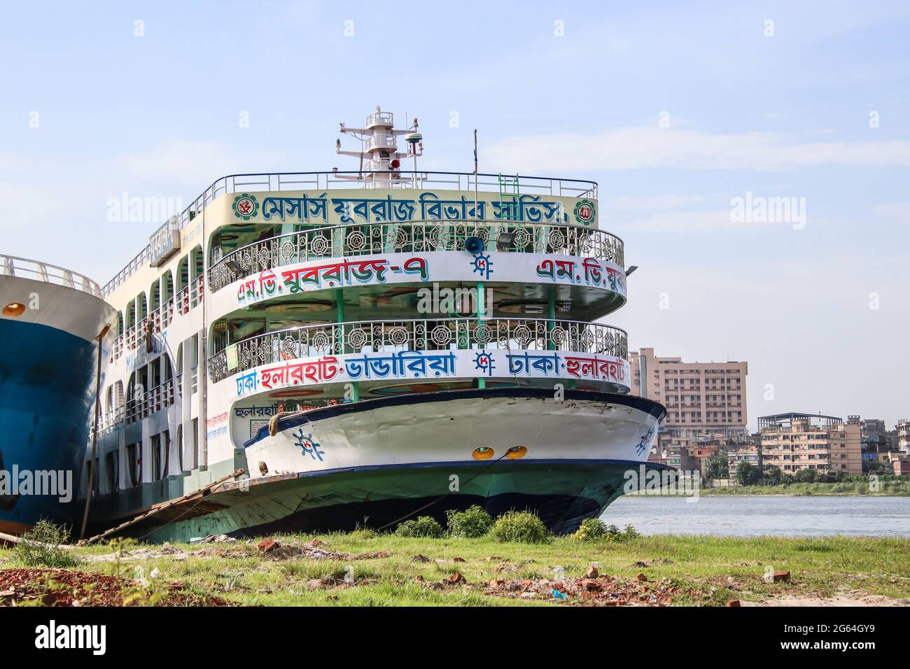 A ferry anchored on the bank of Buriganga river. Ferry is a very ...
