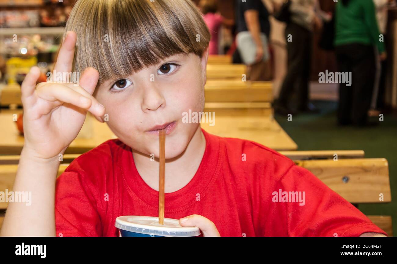 Child sipping drink isolated hi-res stock photography and images - Alamy