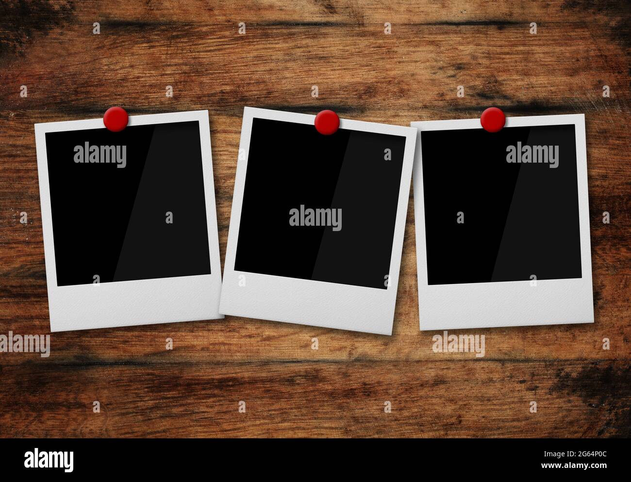 Close up three empty Polaroid instant photo frames pinned on old grunge ...