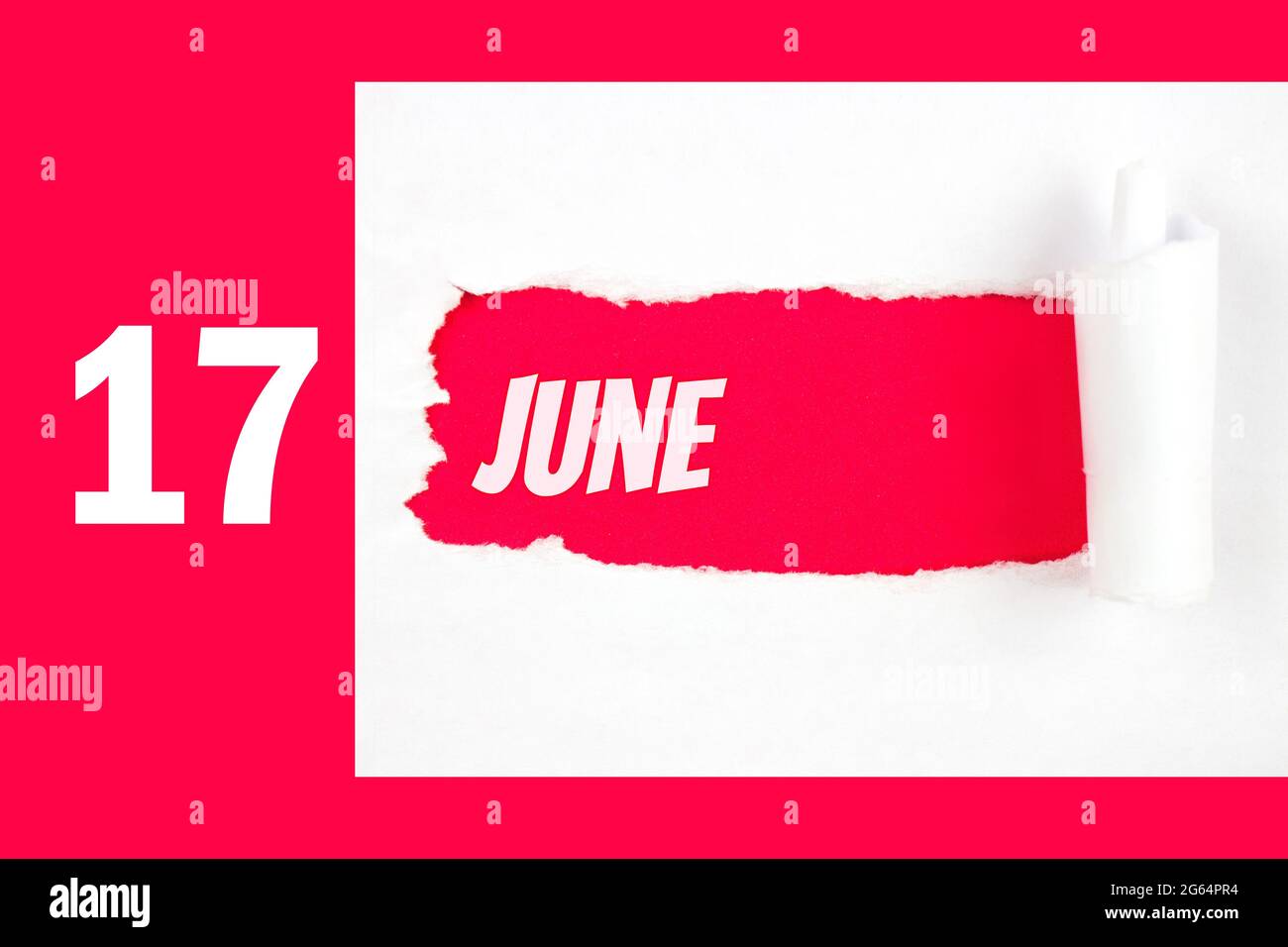 June 17th. Day 17 of month, Calendar date. Red Hole in the white paper ...