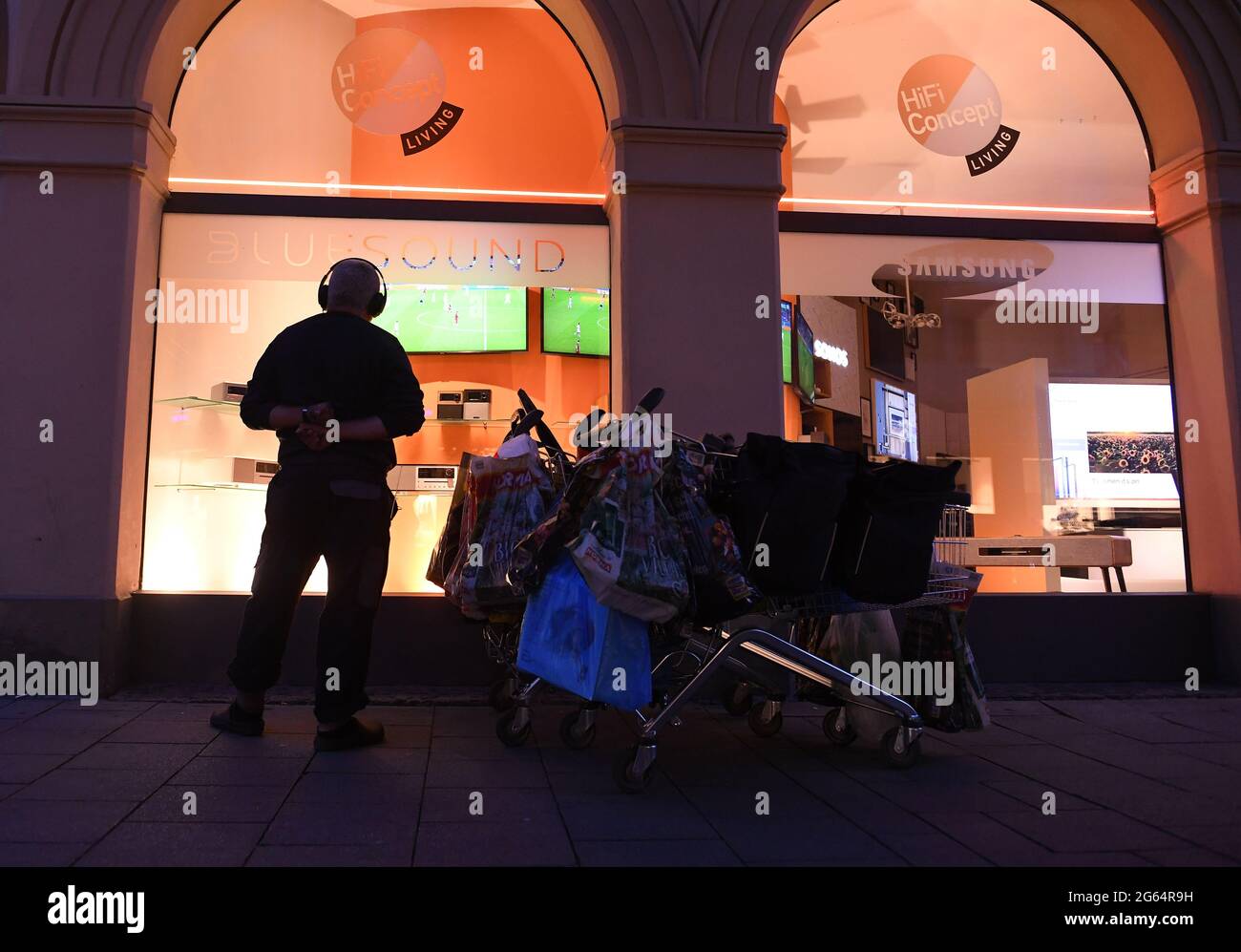 Munich, Germany. 02nd July, 2021. A homeless man is standing in front ...