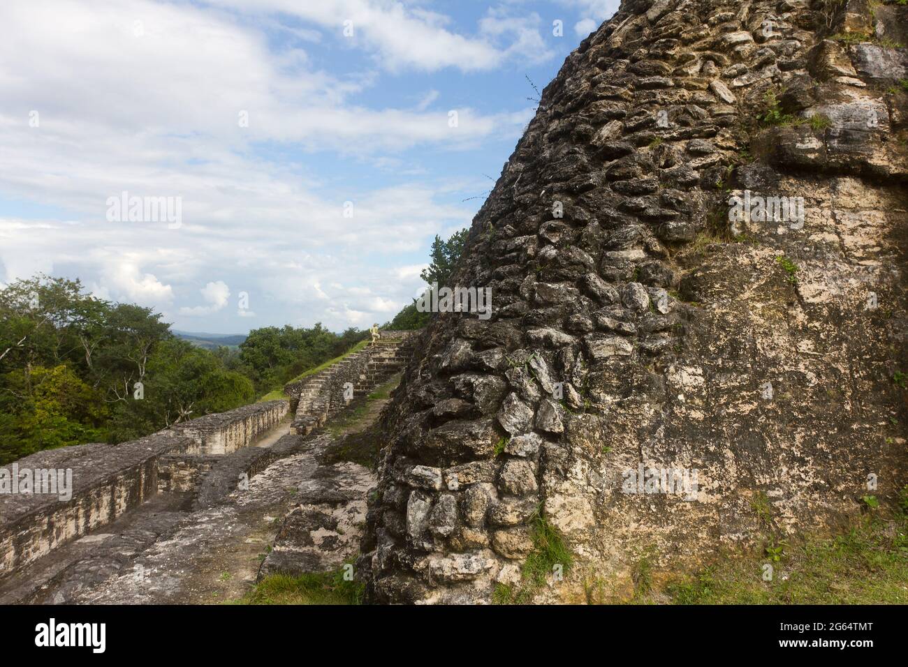 A person walking up its steps gives a sense of scale to "El Castillo ...