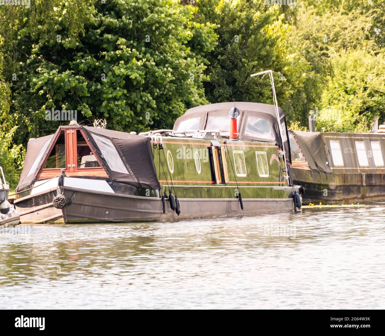 Front on view of unidentifiable traditional wooden narrow boats moored ...