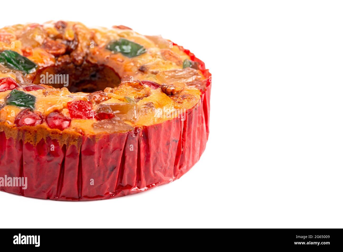 Round Fruit Cake with Cherries Pineapples and Nuts on a White ...