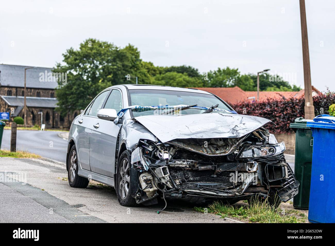 Smashed Car with Police Tape Stock Photo - Alamy