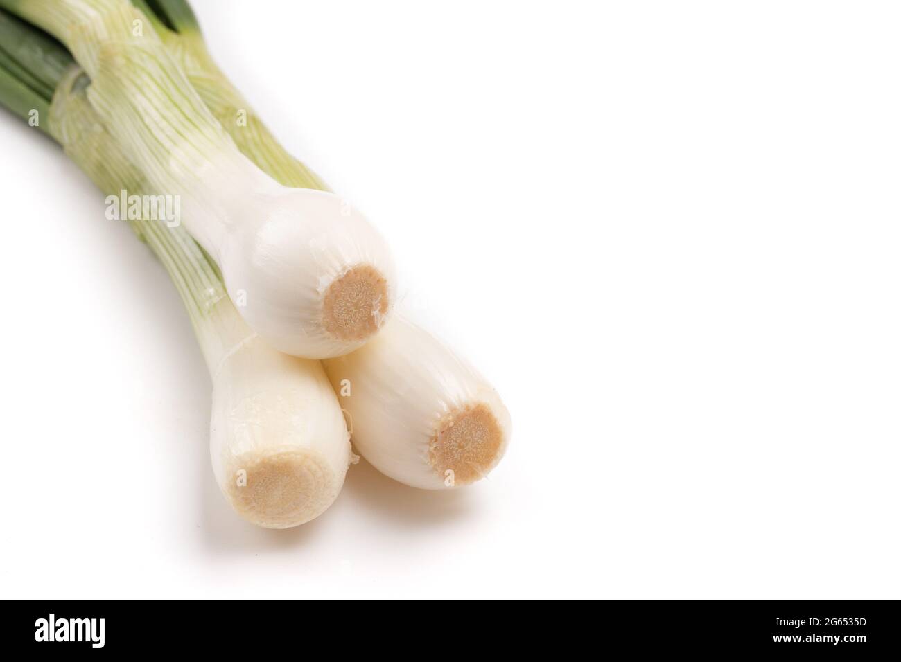 Three Spring Onions on a White Background Stock Photo - Alamy