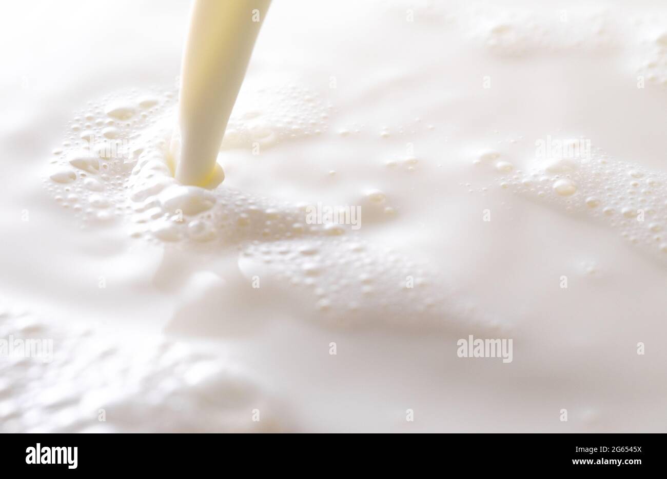A Steam of Milk Being Poured in a Bowl Milk Stock Photo - Alamy