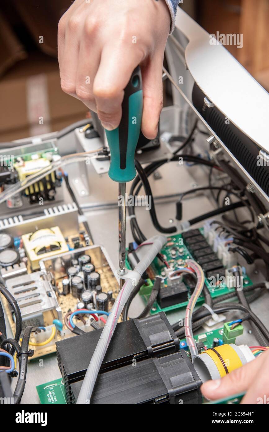 Hand holding electrical wires hi-res stock photography and images - Alamy