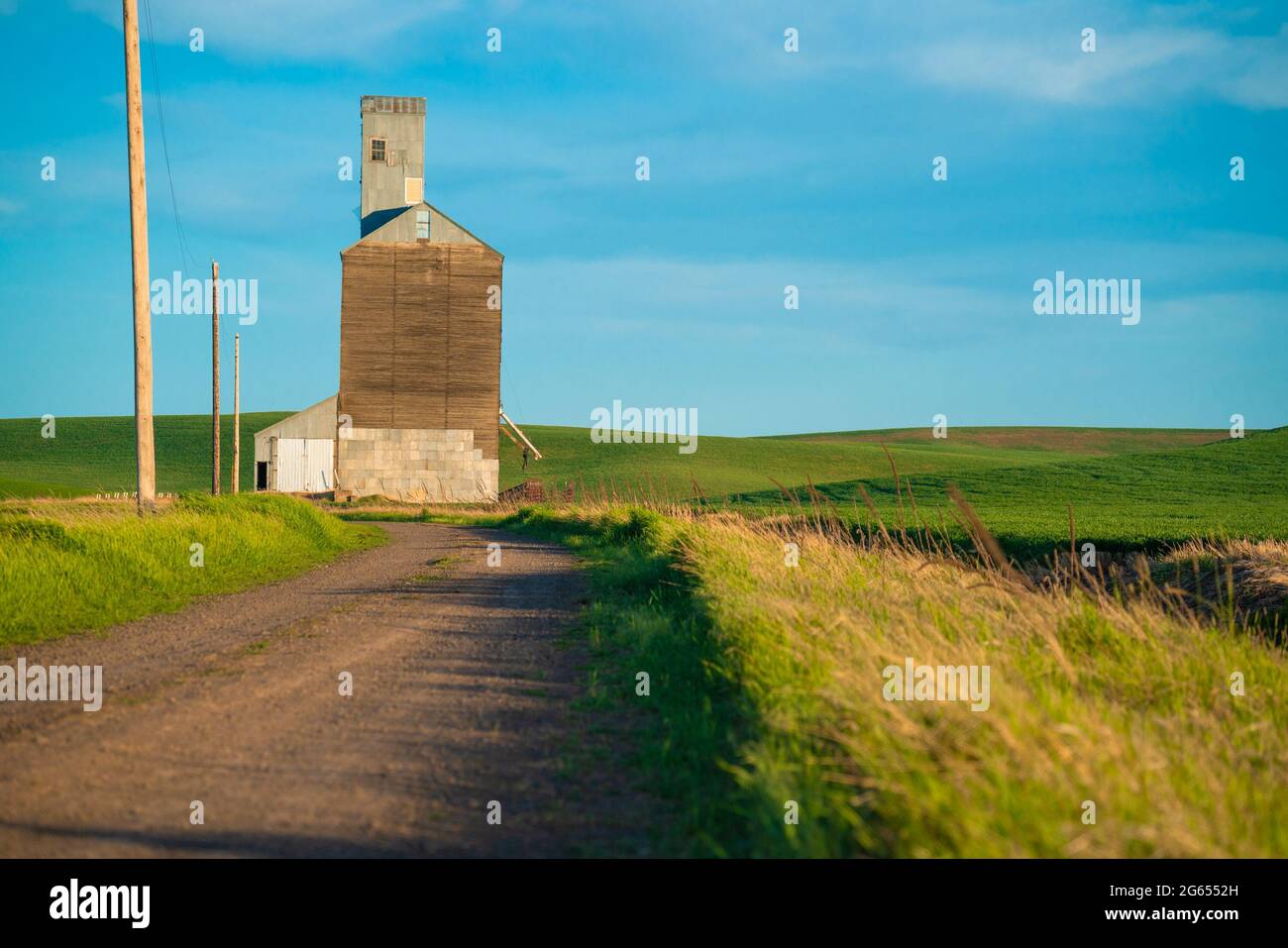 View of industrial grain elevator seen from wheat farm in the Palouse ...