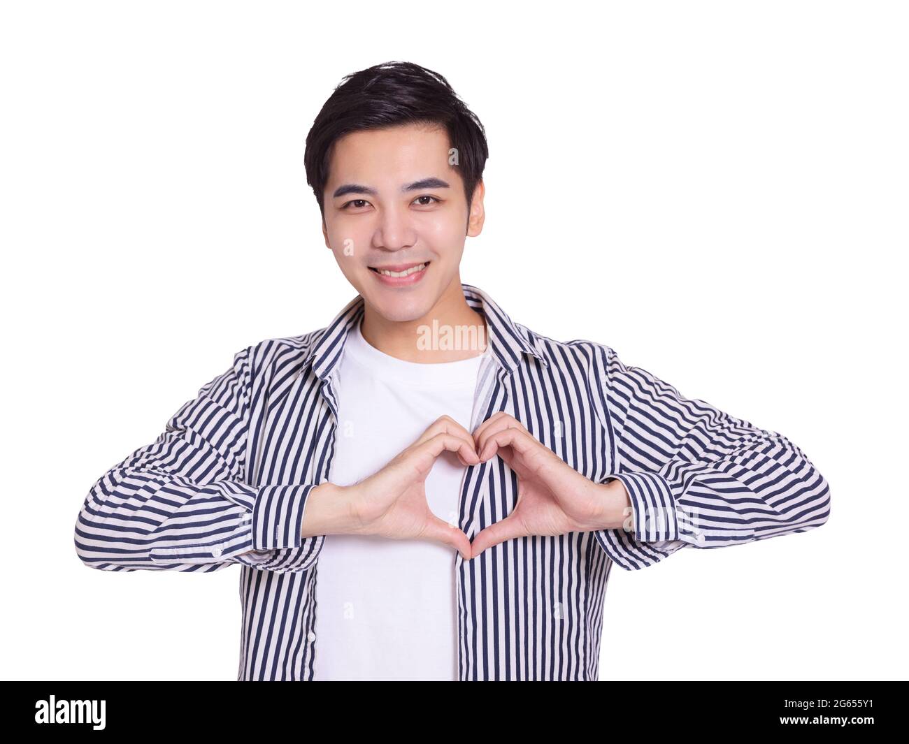 The young and handsome man showing heart-shaped gesture on his left ...