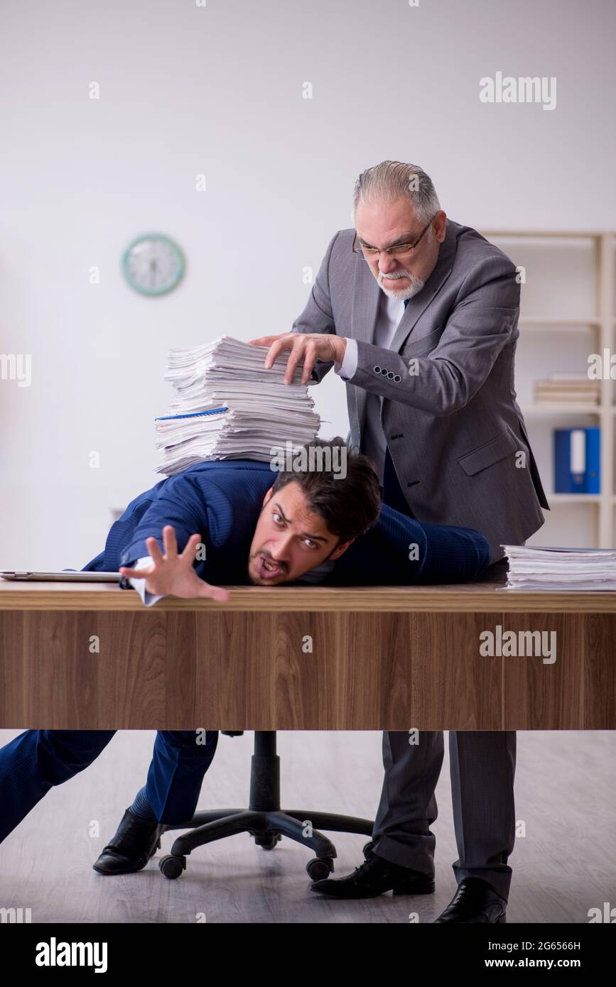 Two employees and too much work in the office Stock Photo - Alamy
