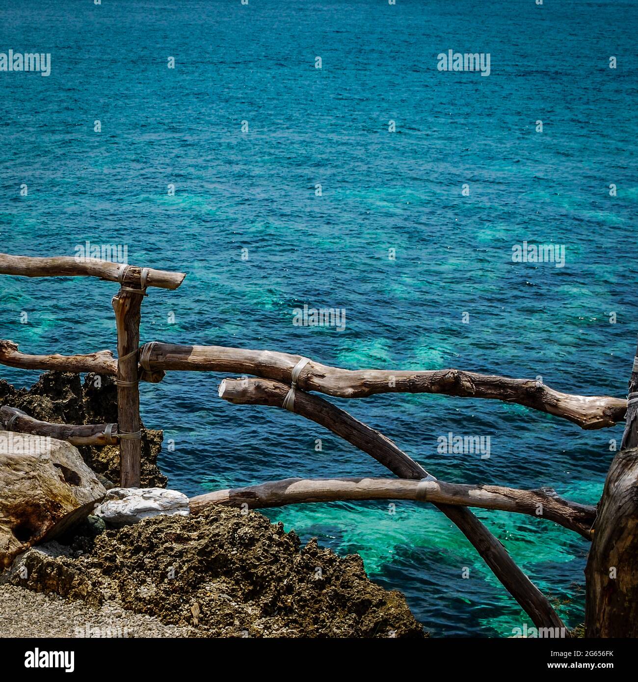 Wooden fence overlooking the blue sea Stock Photo - Alamy