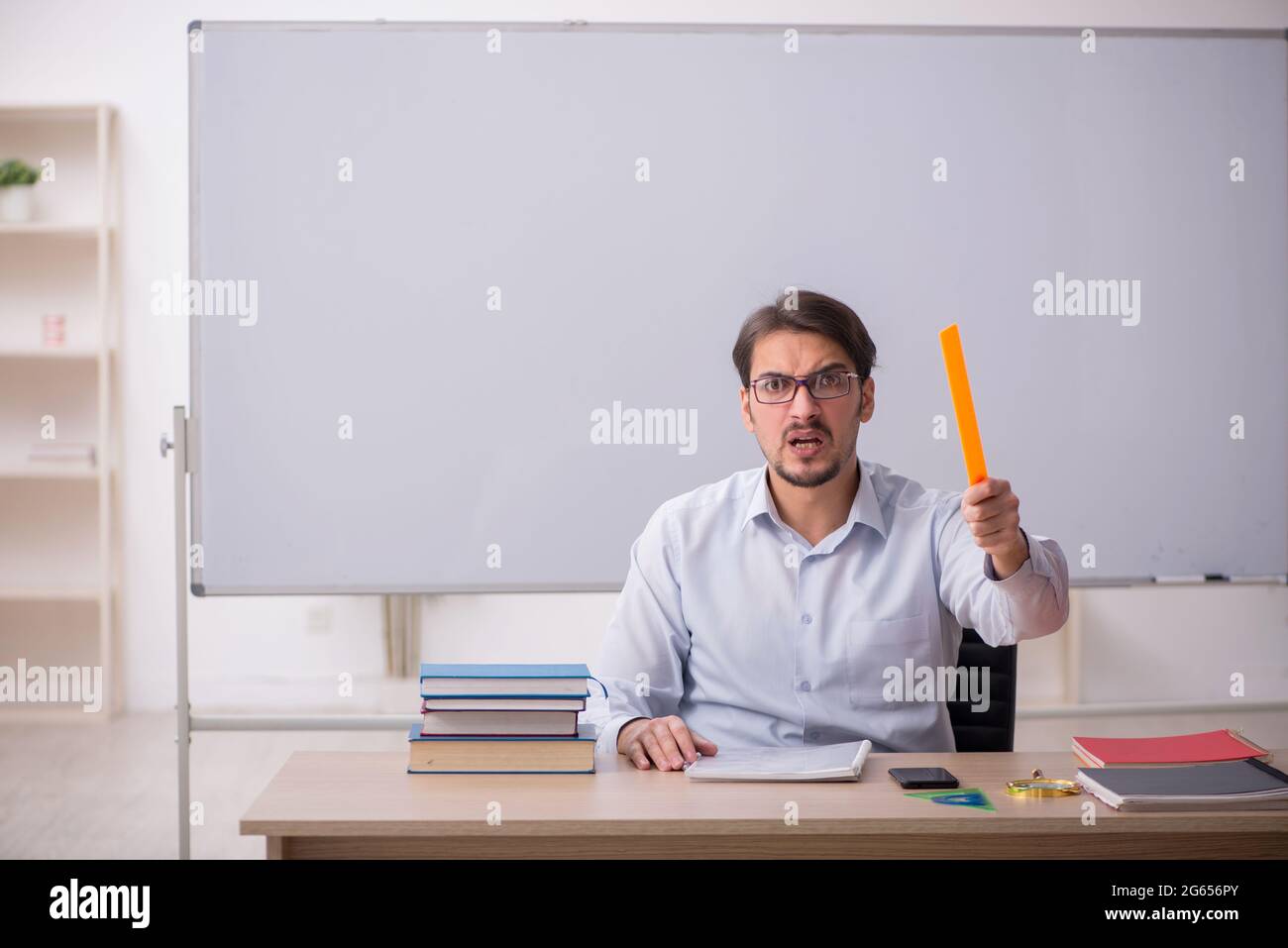 Angry teacher and ruler hi-res stock photography and images - Alamy