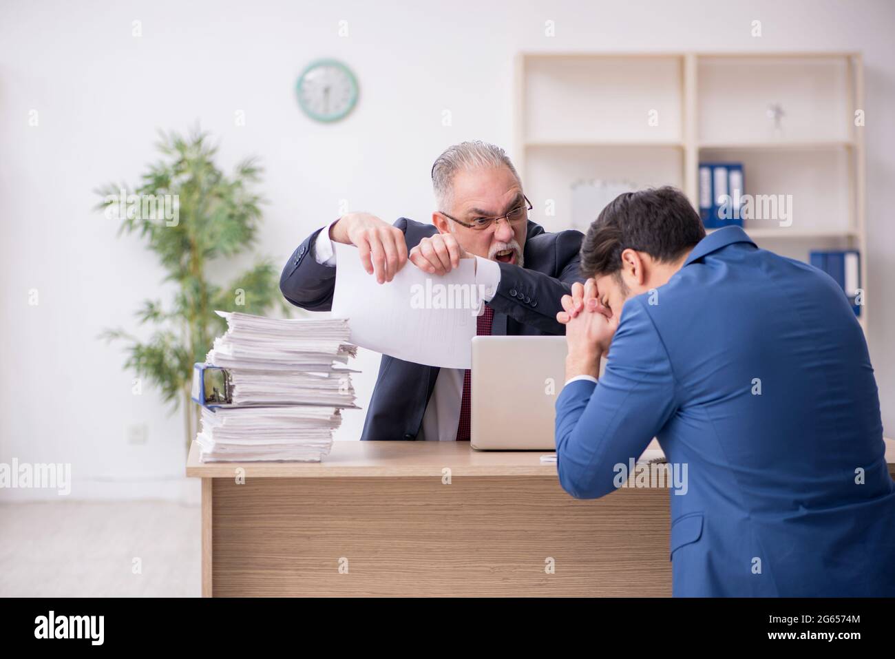Two employees in dismissal concept Stock Photo - Alamy