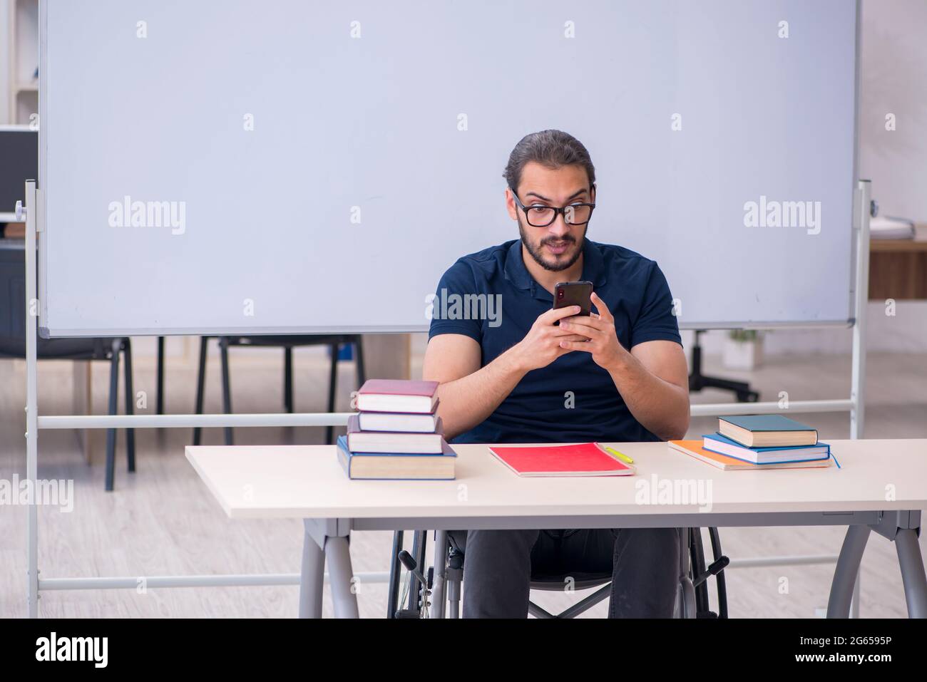 Young handicapped student in the classroom Stock Photo - Alamy