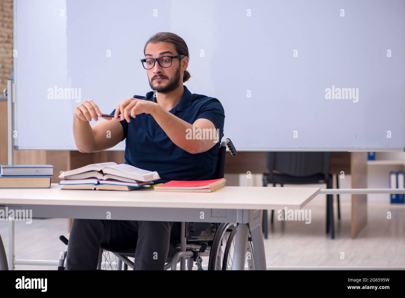 Young handicapped student in the classroom Stock Photo - Alamy