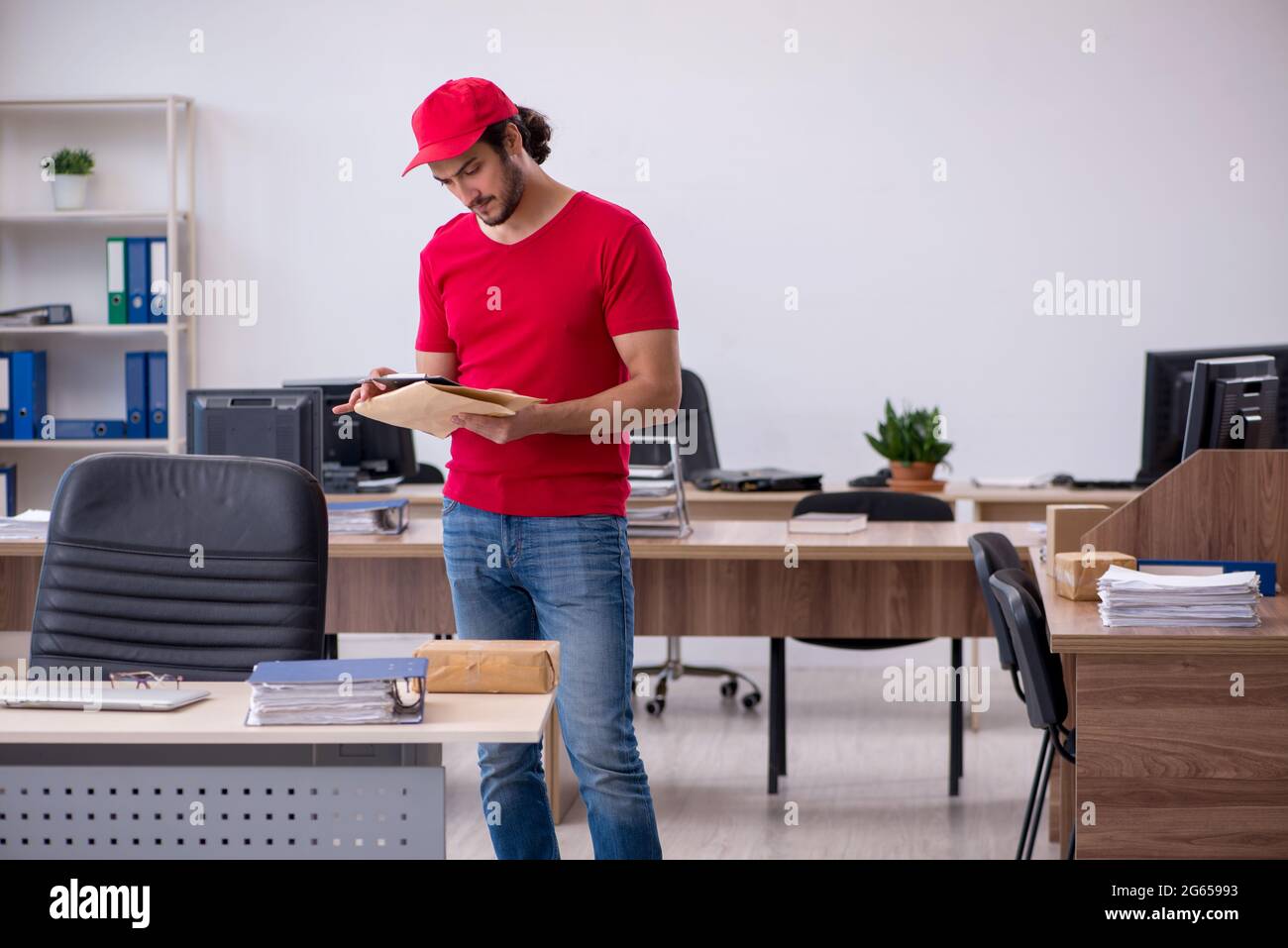 Guy holding package mailbox hi-res stock photography and images - Alamy