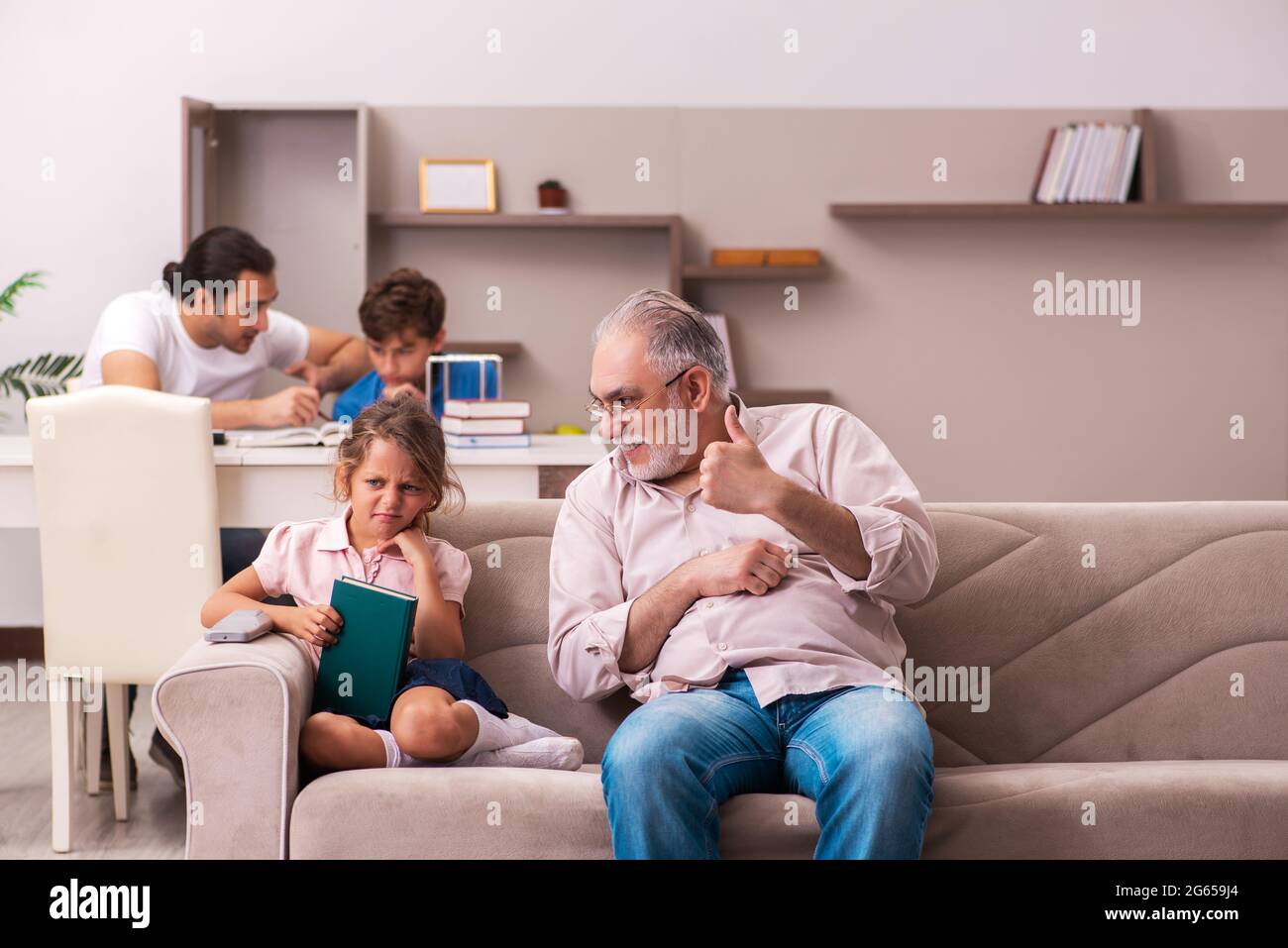 Three generations at home in early development concept Stock Photo - Alamy
