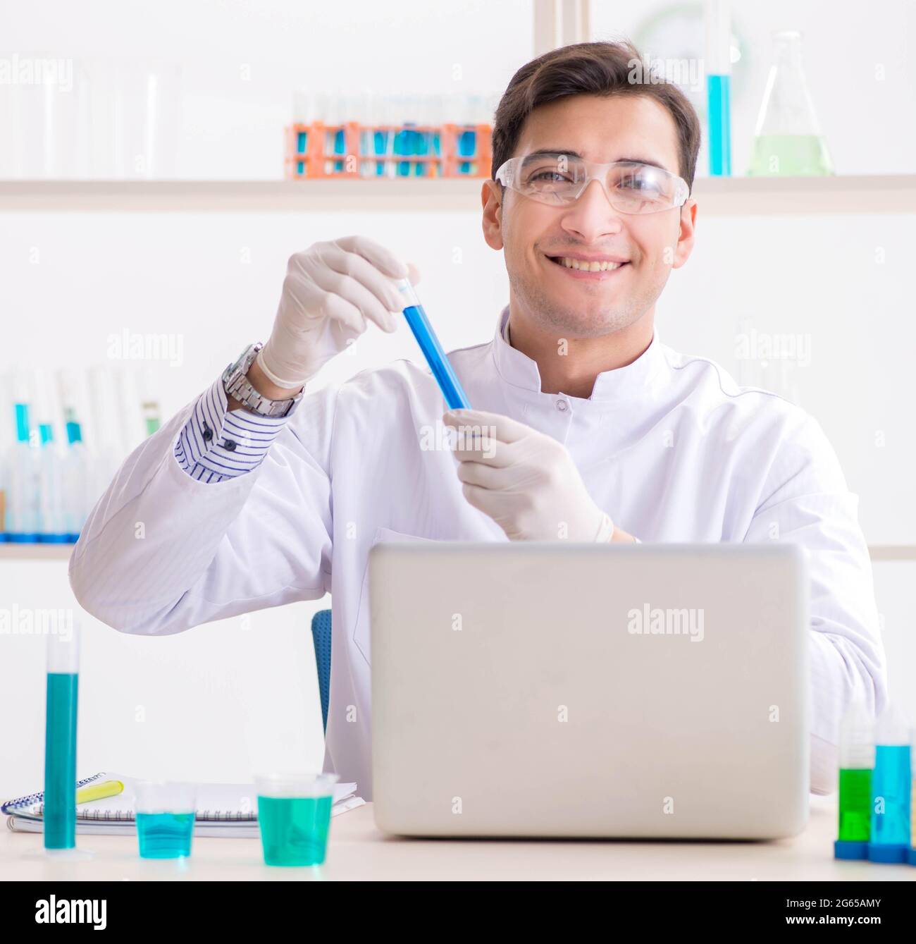 The man student working in chemical lab on experiment Stock Photo - Alamy